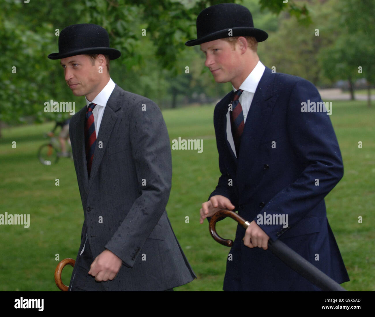 Prince William (left) and Prince Harry arrive in suits and bowler hats ...