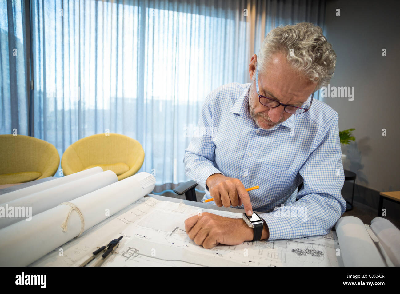 Man adjusting time on his watch Stock Photo - Alamy