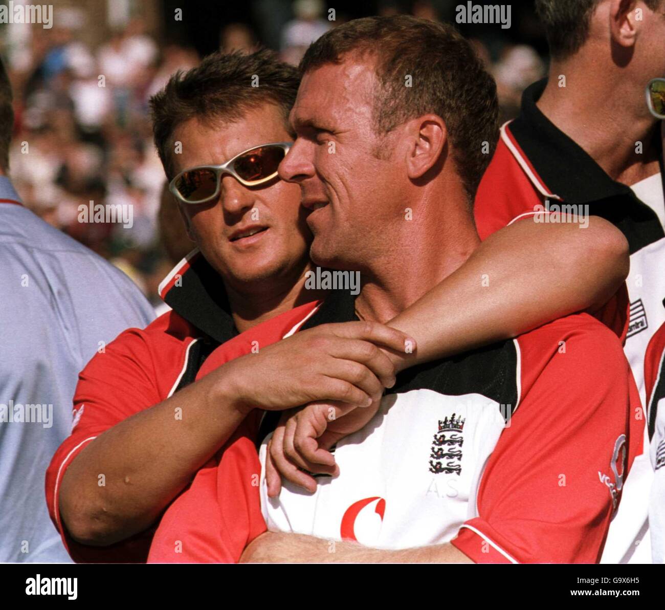 England's Darren Gough consoles Alec Stewart following their defeat to Australia in the final ...