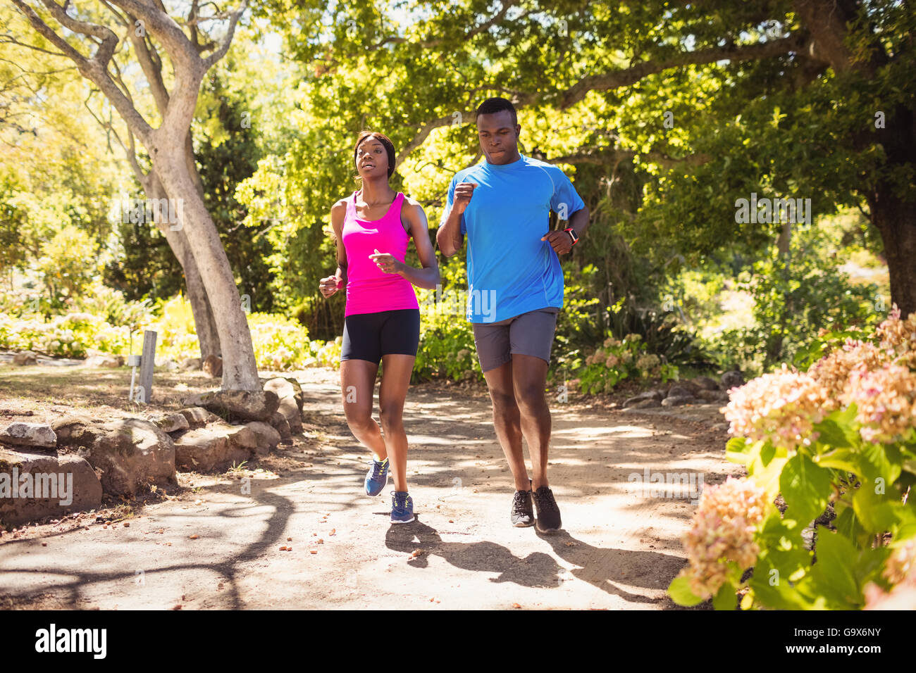 Couple running together Stock Photo - Alamy