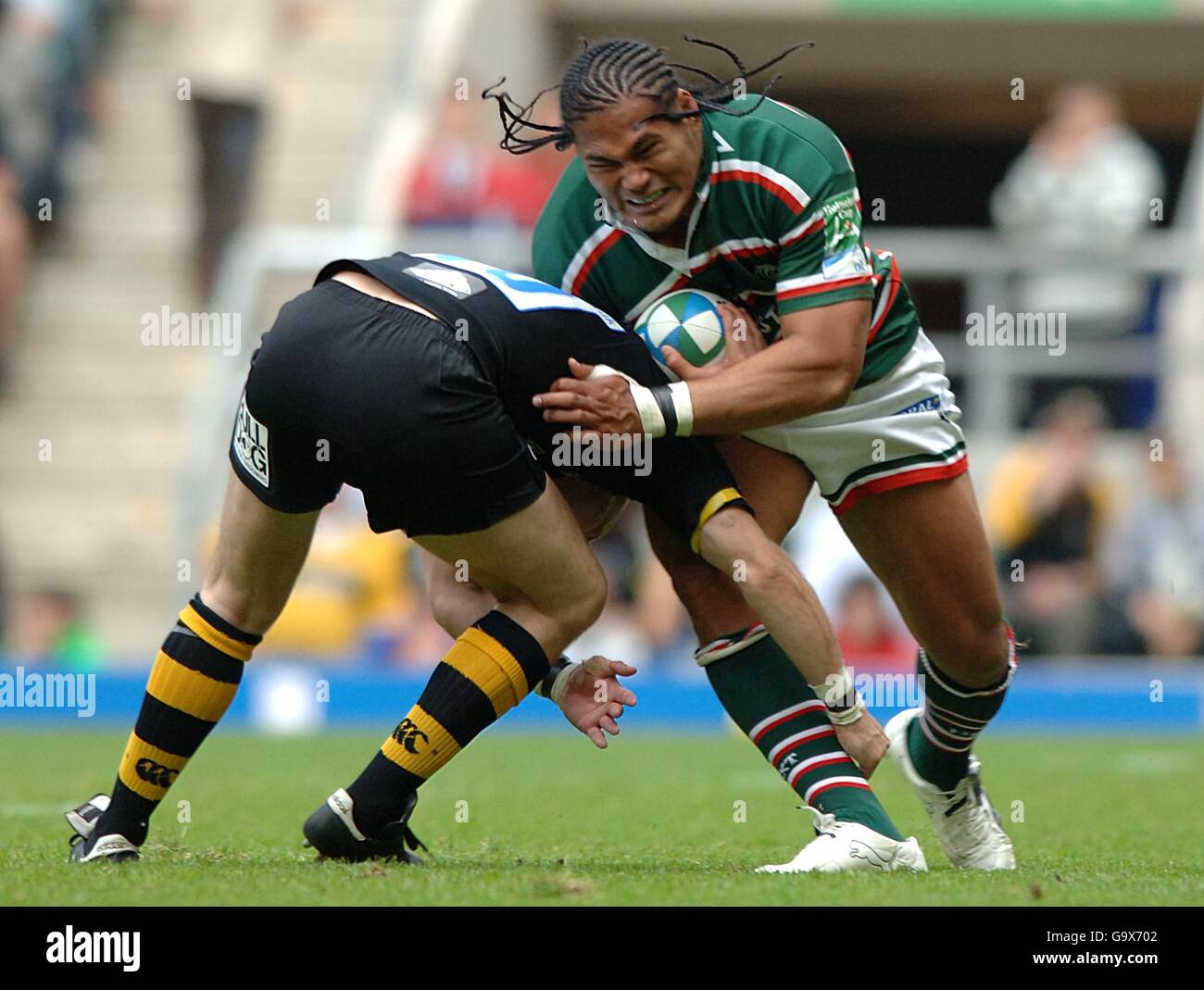 Leicester Tigers' Alesana Tuilagi is tackled by London Wasps' Alex King ...
