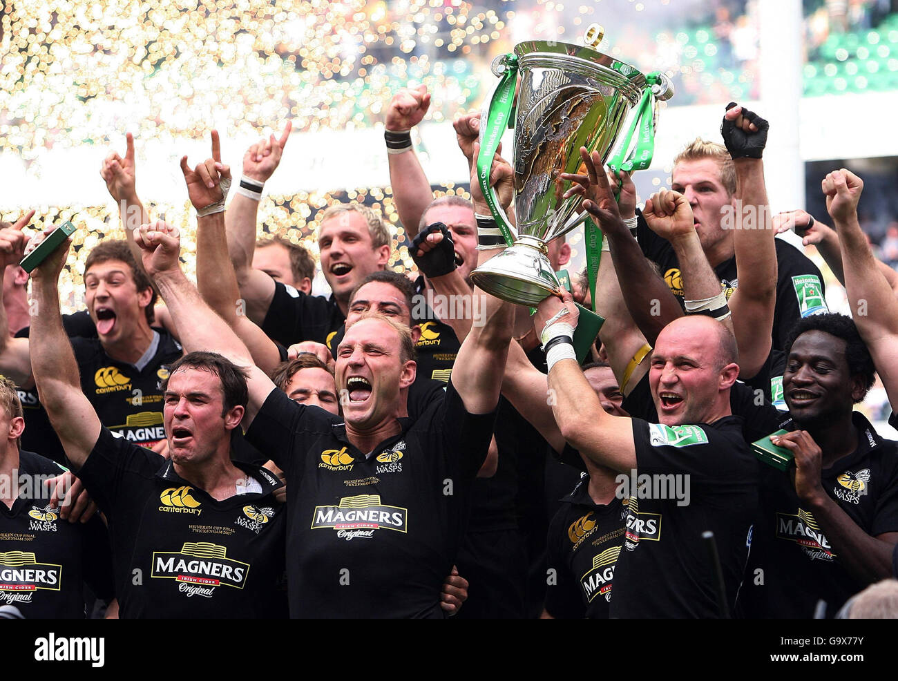 Leicester tigers players celebrate with the cup hi-res stock ...