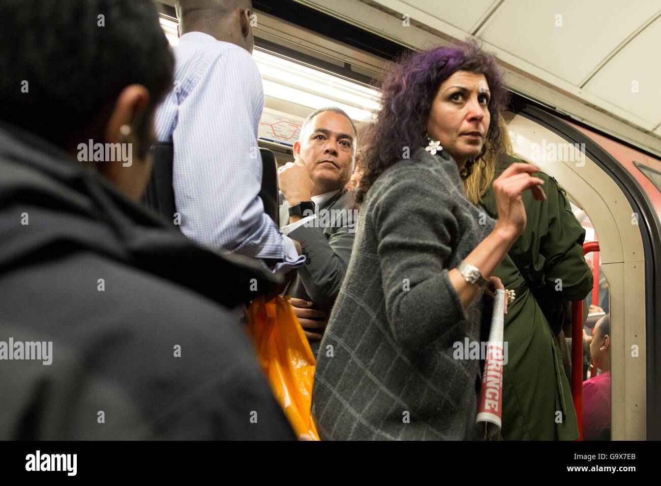 People on The London Underground in London Stock Photo - Alamy