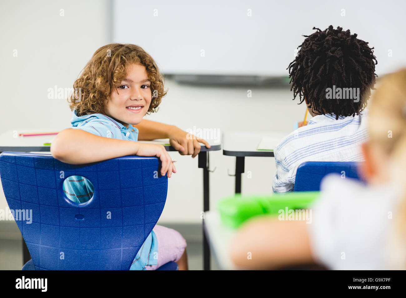 Cute smiling kids in classroom hi-res stock photography and images - Alamy