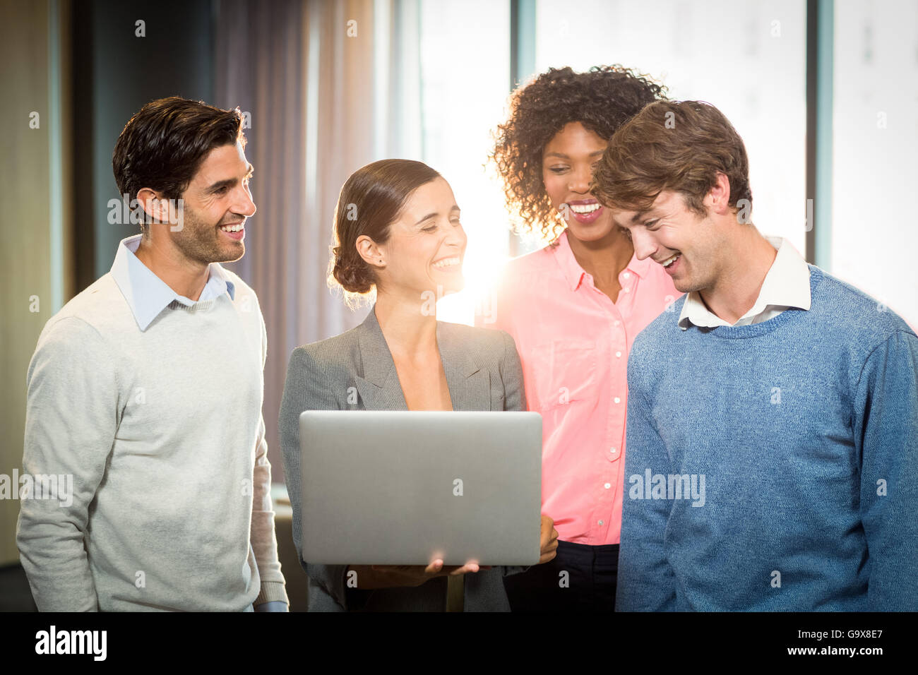 Business people having discussion over laptop Stock Photo - Alamy