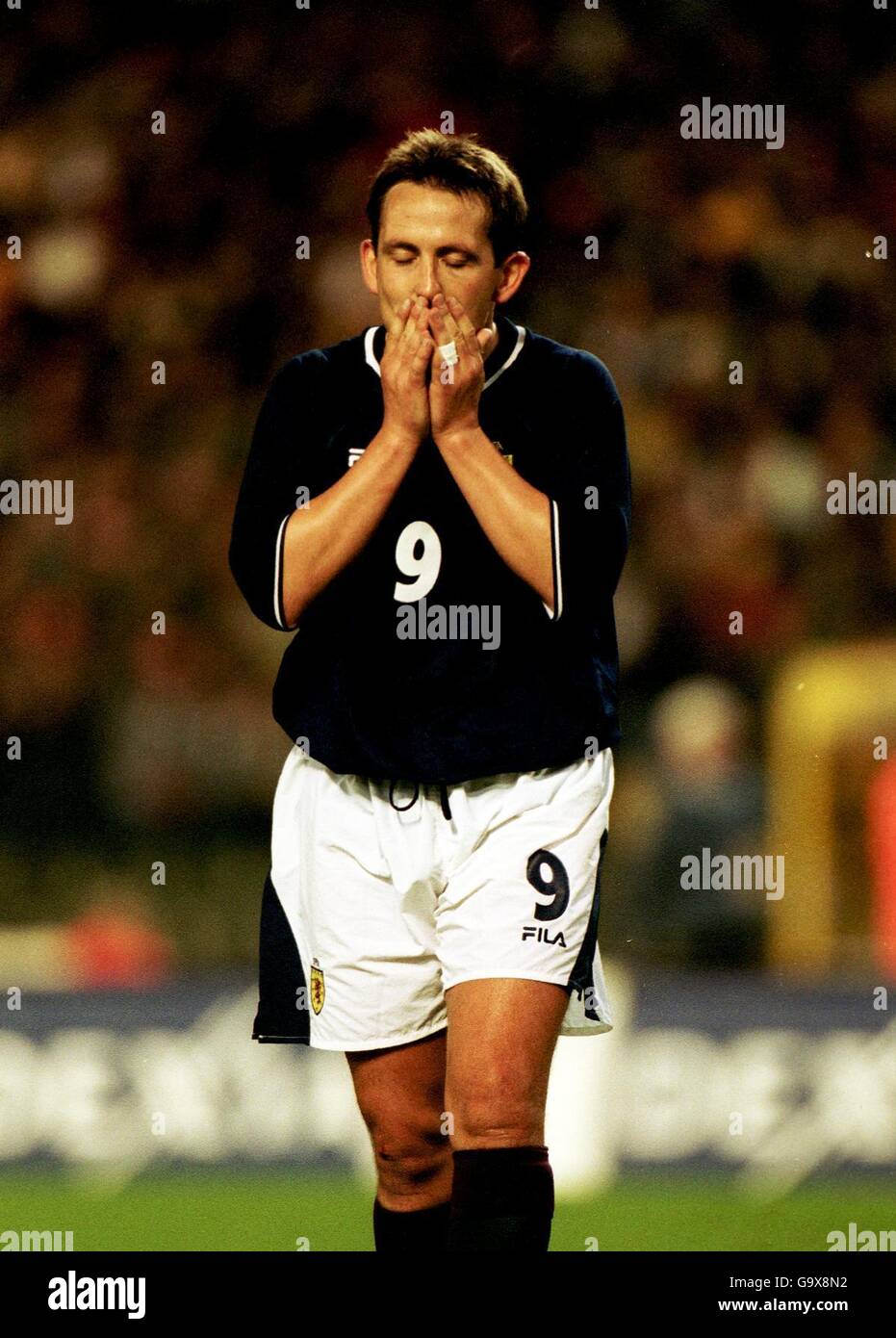 Scotland's Billy Dodds holds his head in his hands after failing to win ...