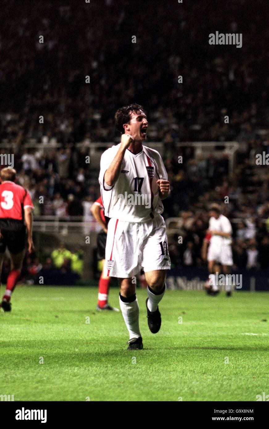 England's Robbie Fowler celebrates scoring the second goal against ...