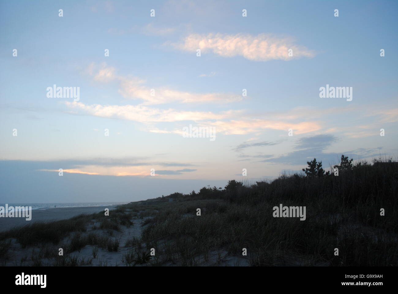 Sun reflecting off clouds at the beach Stock Photo - Alamy