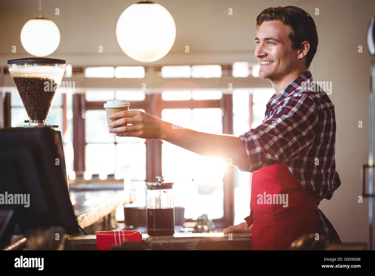 Man offering coffee cup hi-res stock photography and images - Alamy