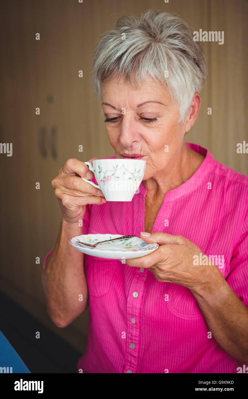 Smiling nurse holding tea hi-res stock photography and images - Alamy