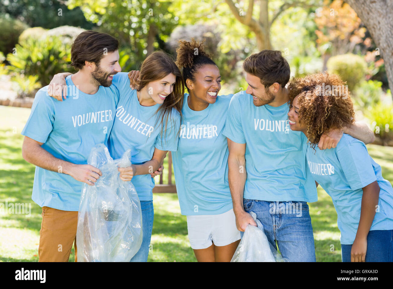 Group of volunteer having fun Stock Photo - Alamy