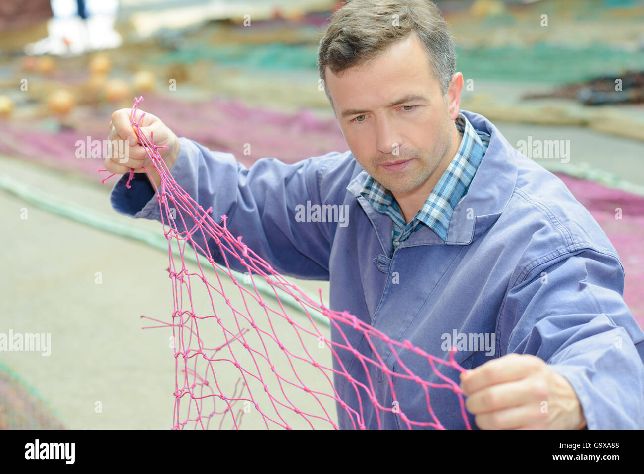 Handsome young fisherman hi-res stock photography and images - Alamy