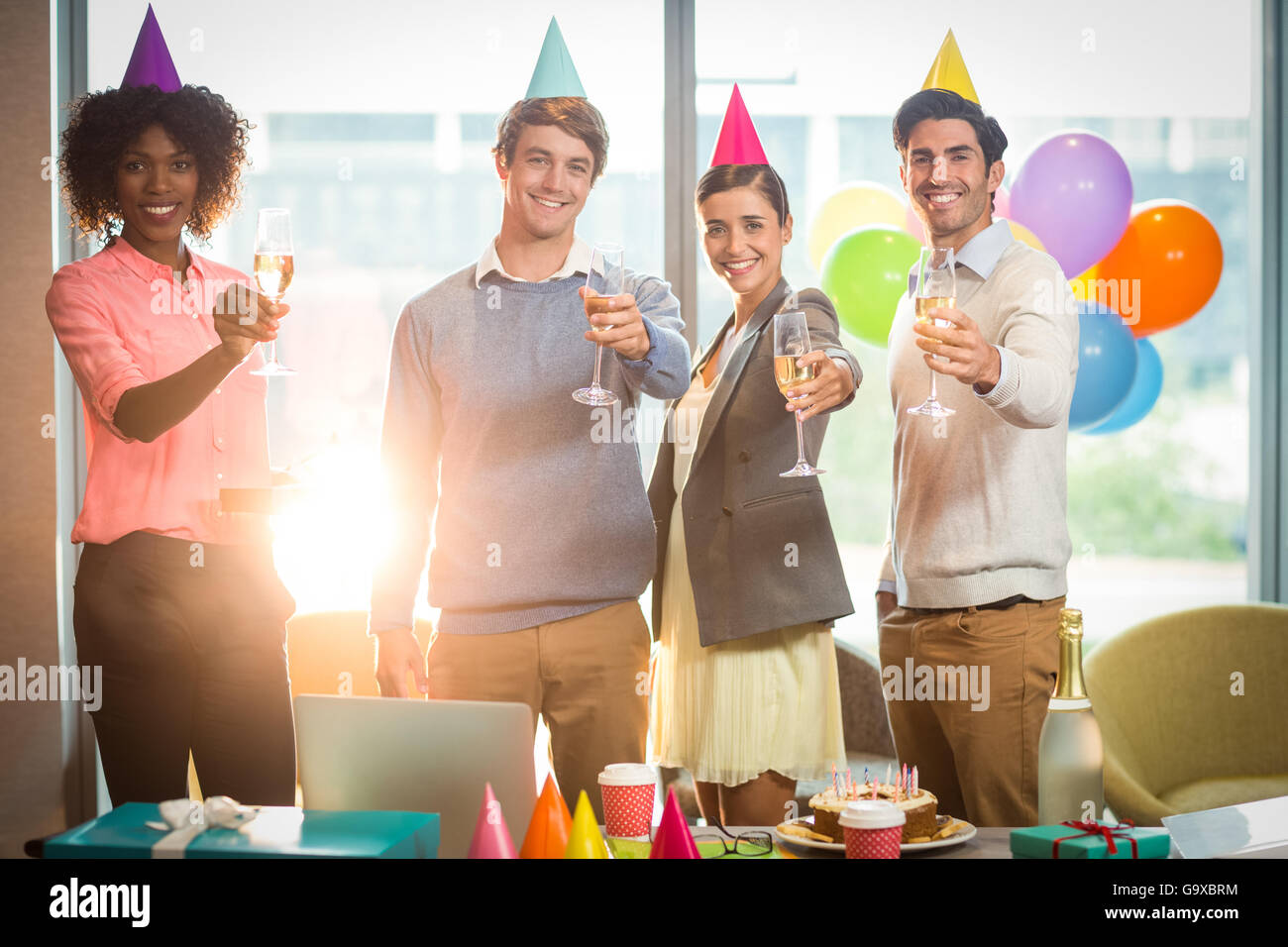 Portrait of business people celebrating birthday Stock Photo - Alamy