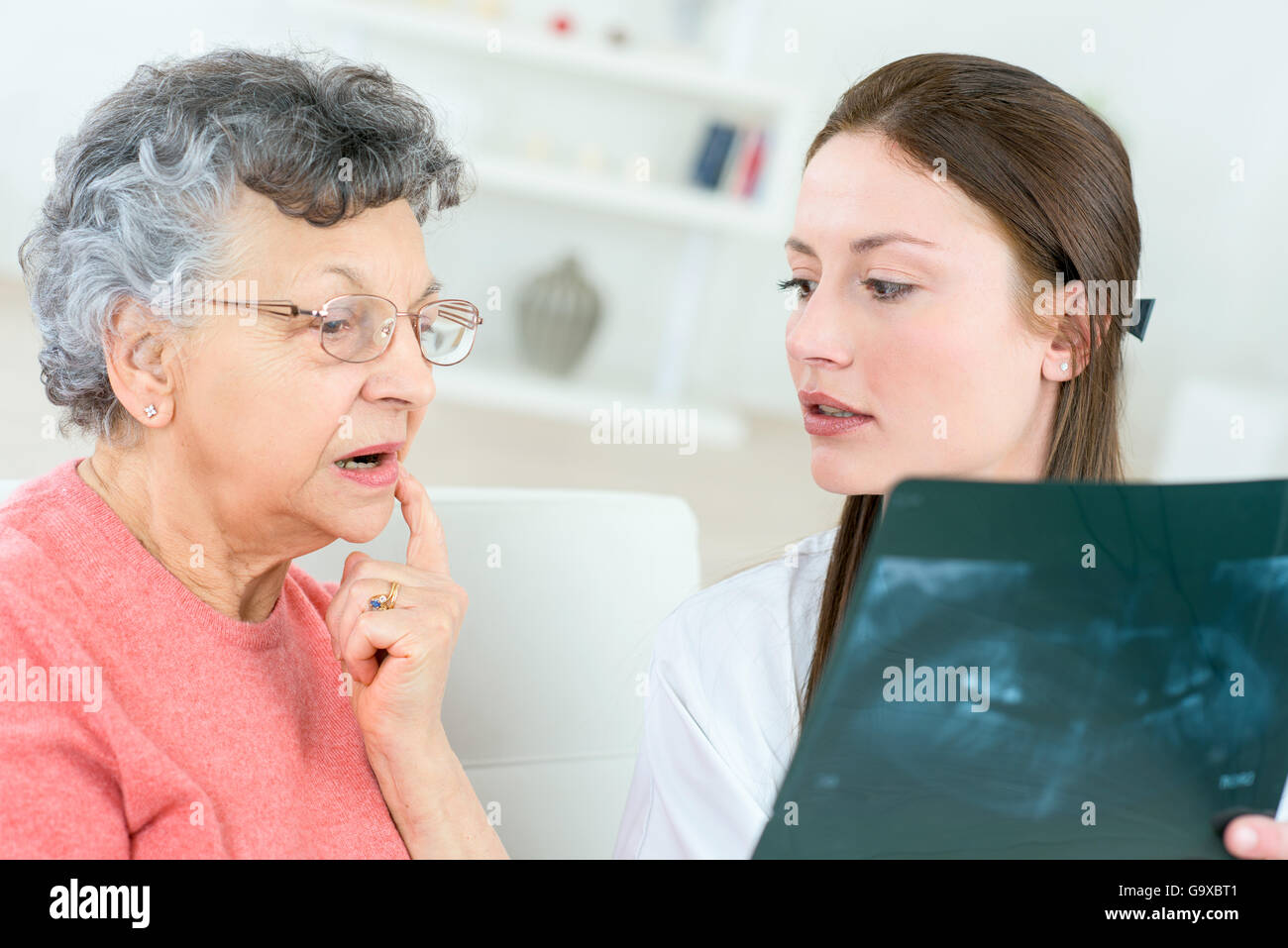 Showing senior patient an x-ray Stock Photo - Alamy