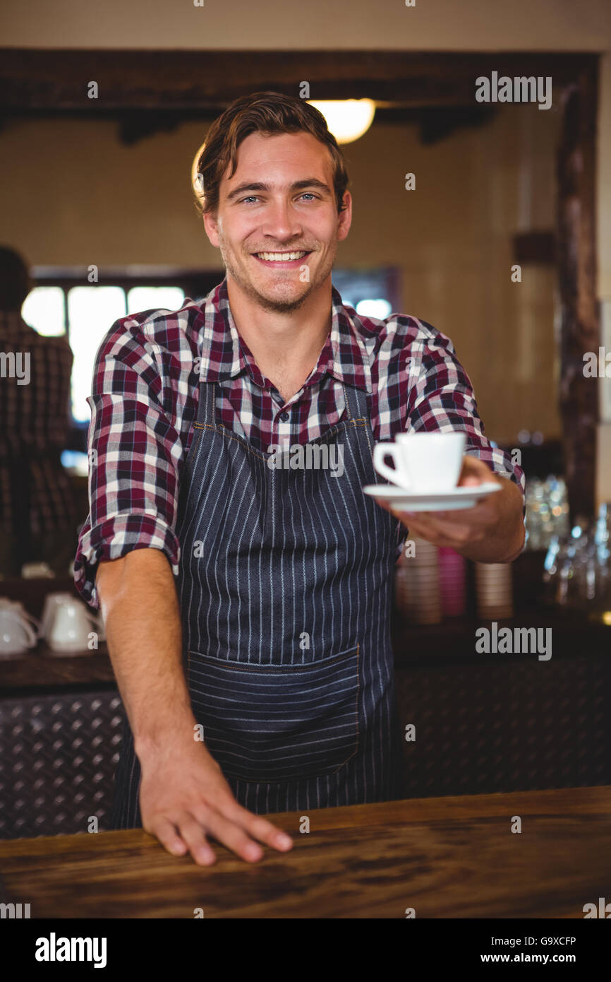 Leaning over counter hi-res stock photography and images - Alamy