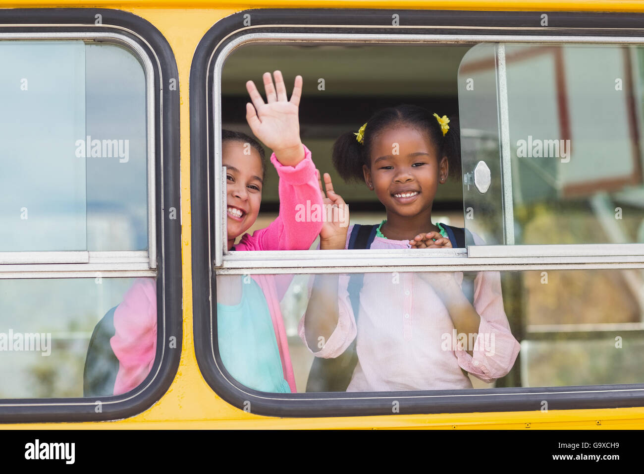 Portrait of school kids waving hand from bus Stock Photo - Alamy