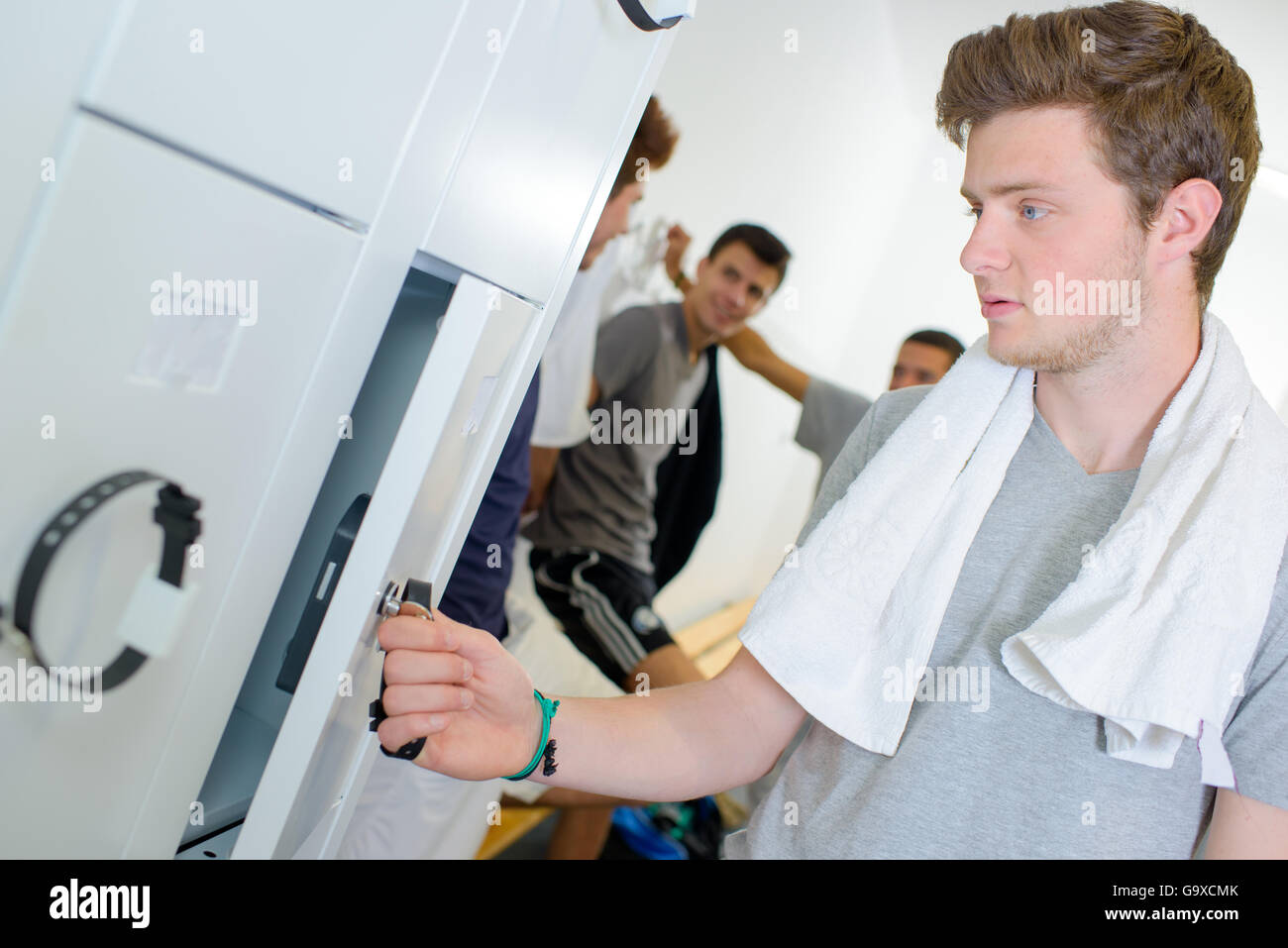 Men in locker room Stock Photo - Alamy