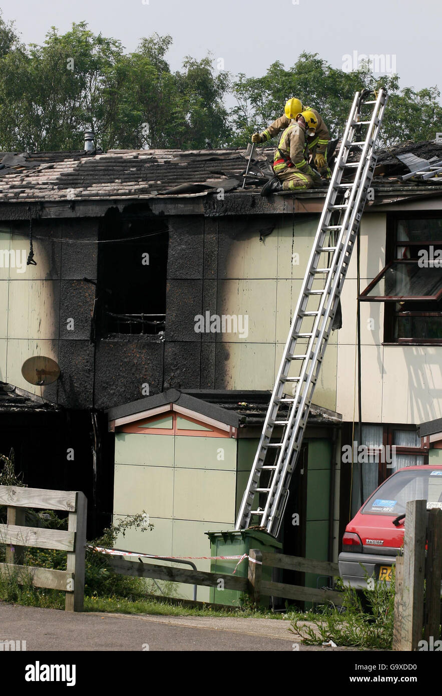 Fireman attend the scene of a house fire in Maidstone, Kent Stock Photo ...