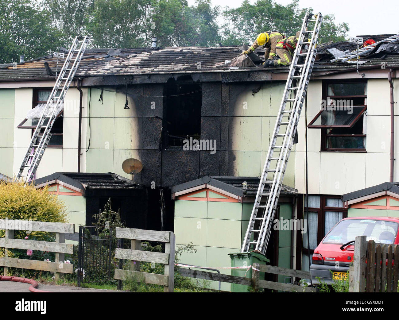 Fireman attend the scene of a house fire in Maidstone, Kent Stock Photo ...
