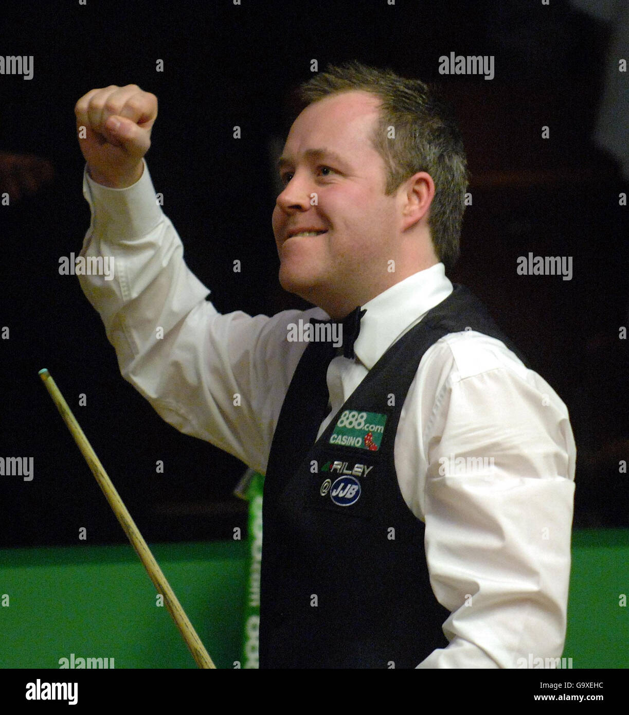 Scotland's John Higgins celebrates his victory in the semi-final match ...