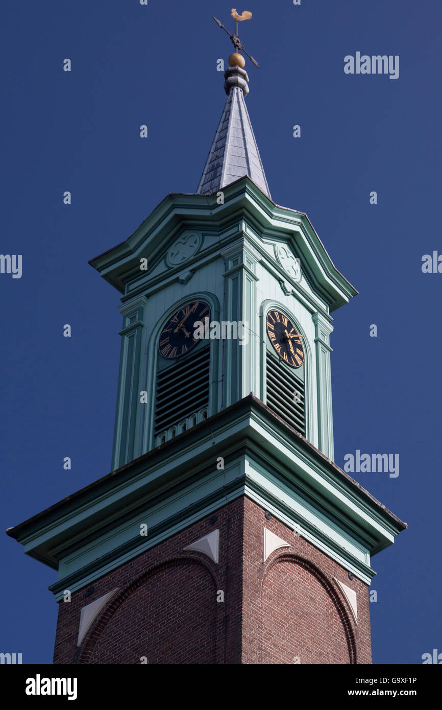 Green church tower on a blue sky Stock Photo - Alamy