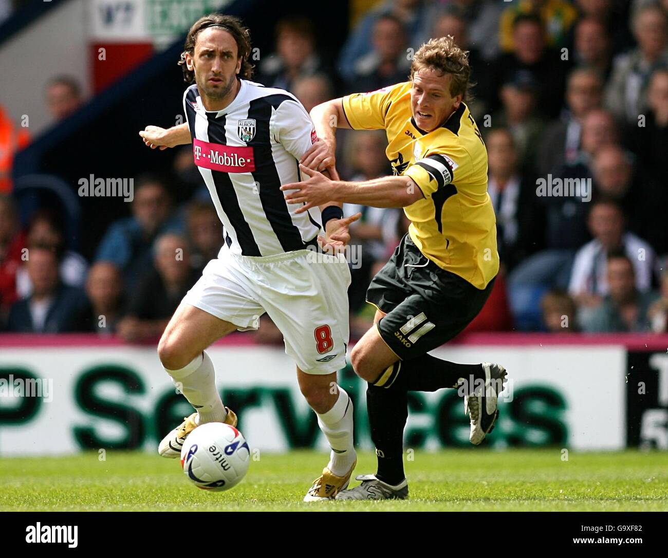Brian Howard, Barnsley and Jonathan Greening, West Brom battle for the ...