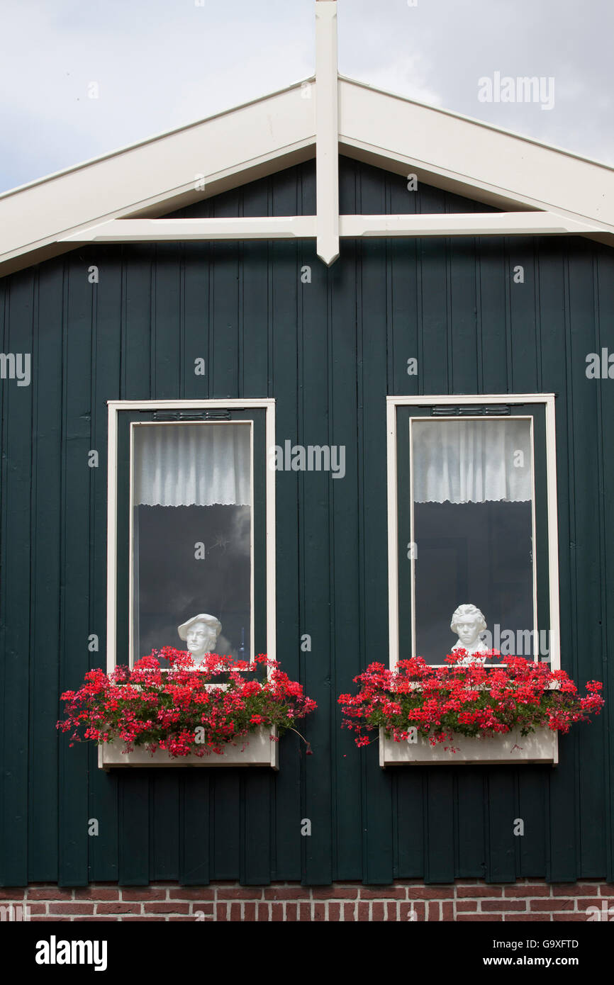 Planters for the window with red flowers Stock Photo - Alamy