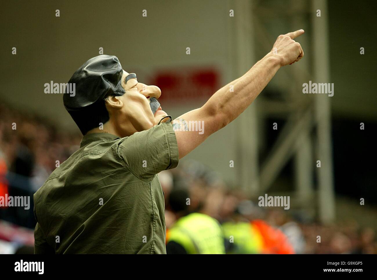 A fan in a saddam hussein mask hi-res stock photography and images - Alamy