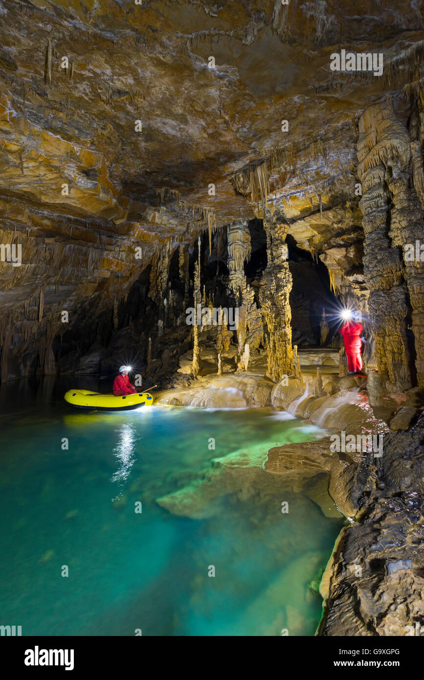 People exploring underground lakes via rigid inflatable boat, Cross ...