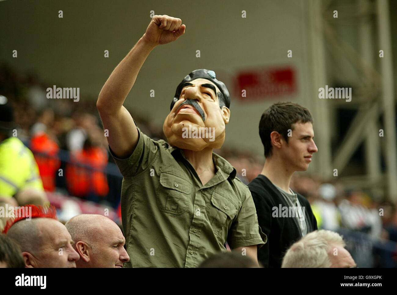 A fan in a saddam hussein mask hi-res stock photography and images - Alamy