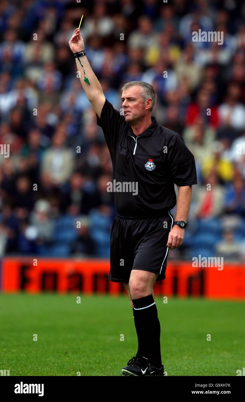 Referee paul danson shows the yellow card hi-res stock photography and ...