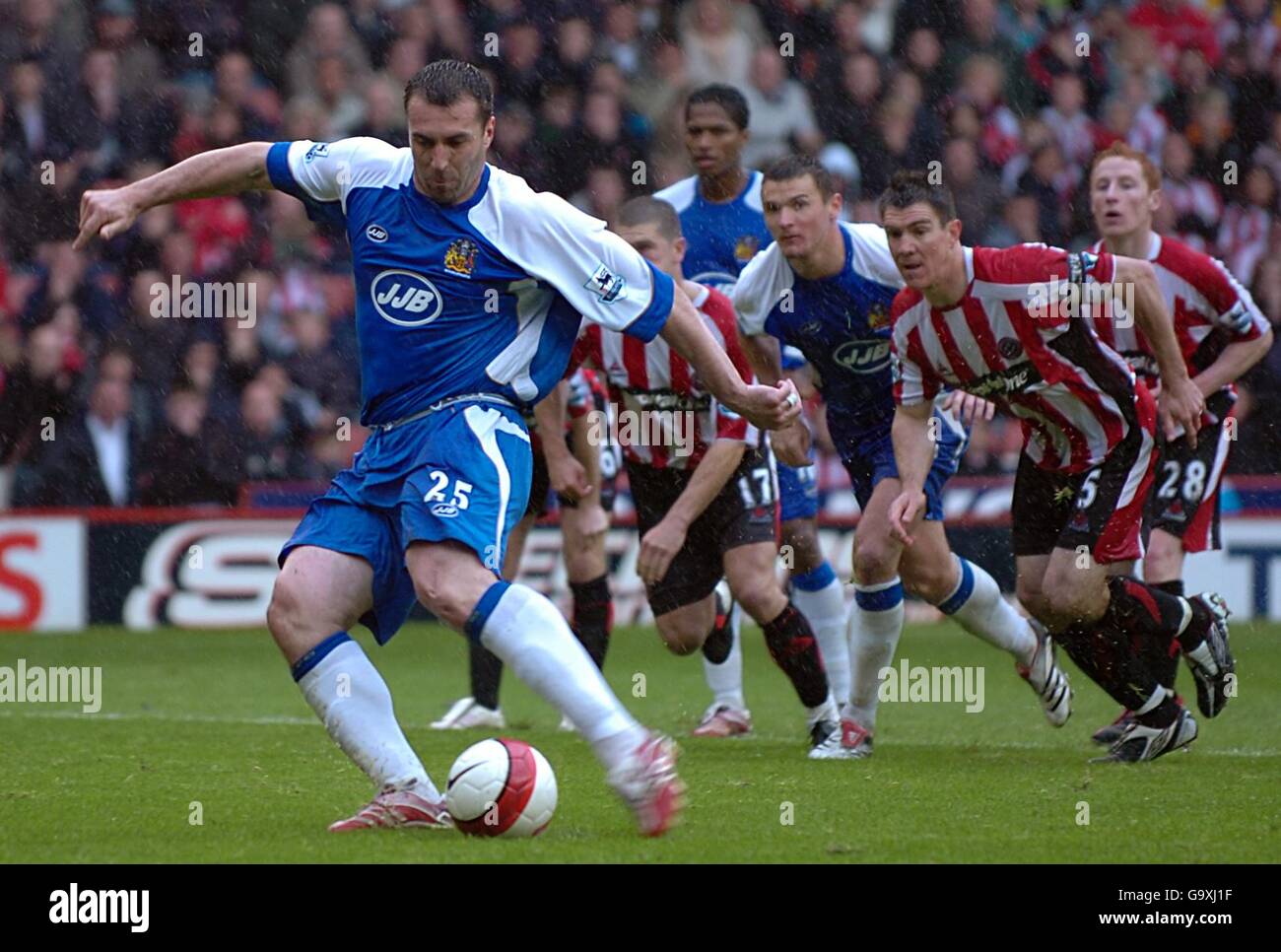 Wigan's David Unsworth scores from the penalty spot to score the third ...