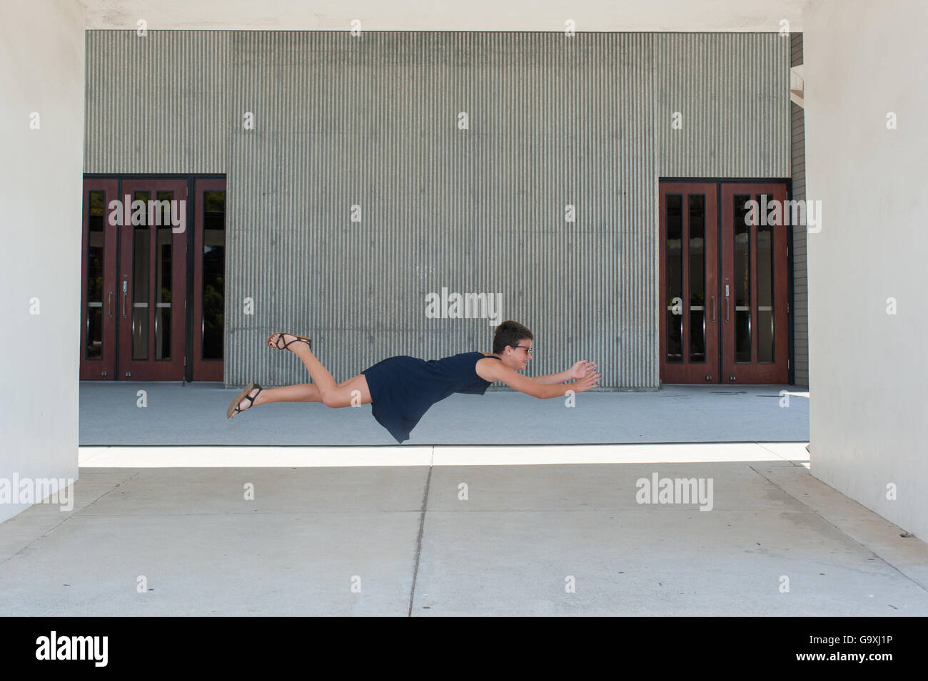 Female teen floating in prone position Stock Photo - Alamy