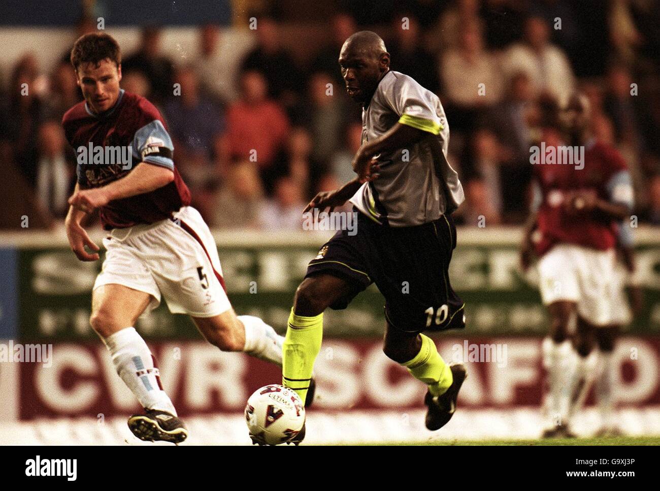 Steve Davis the Burnley captain watches over Shaun Goater of Manchester ...