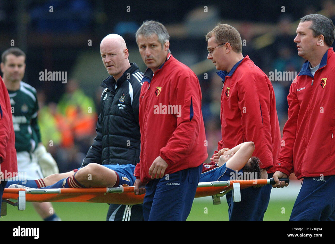 Newcastle United's Michael Owen is stretchered off the pitch after a ...