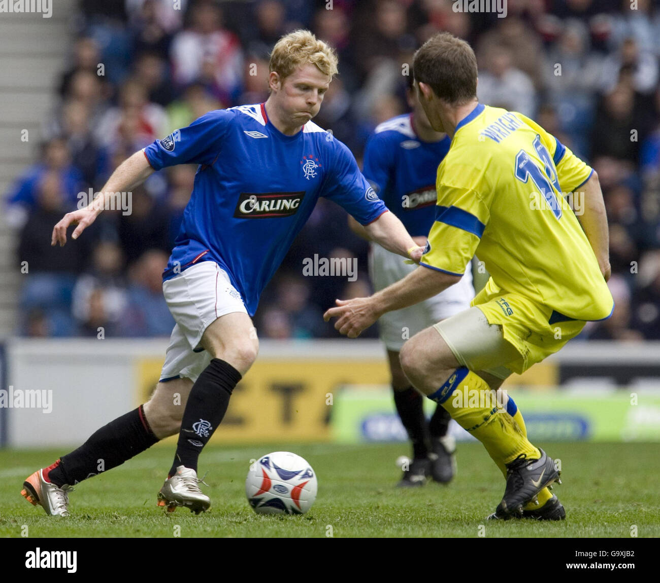 Rangers' Chris Burke (left) in action against Frazer Wright of ...