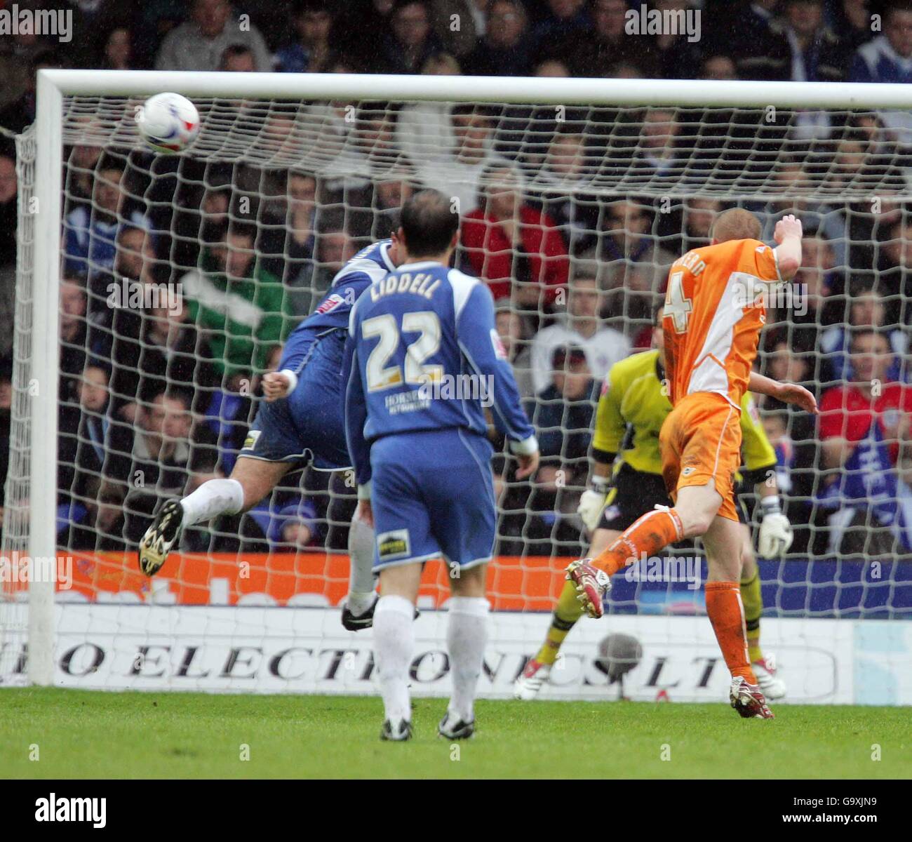 Blackpool's Keith Southern has a header on the Oldham goal Stock Photo ...