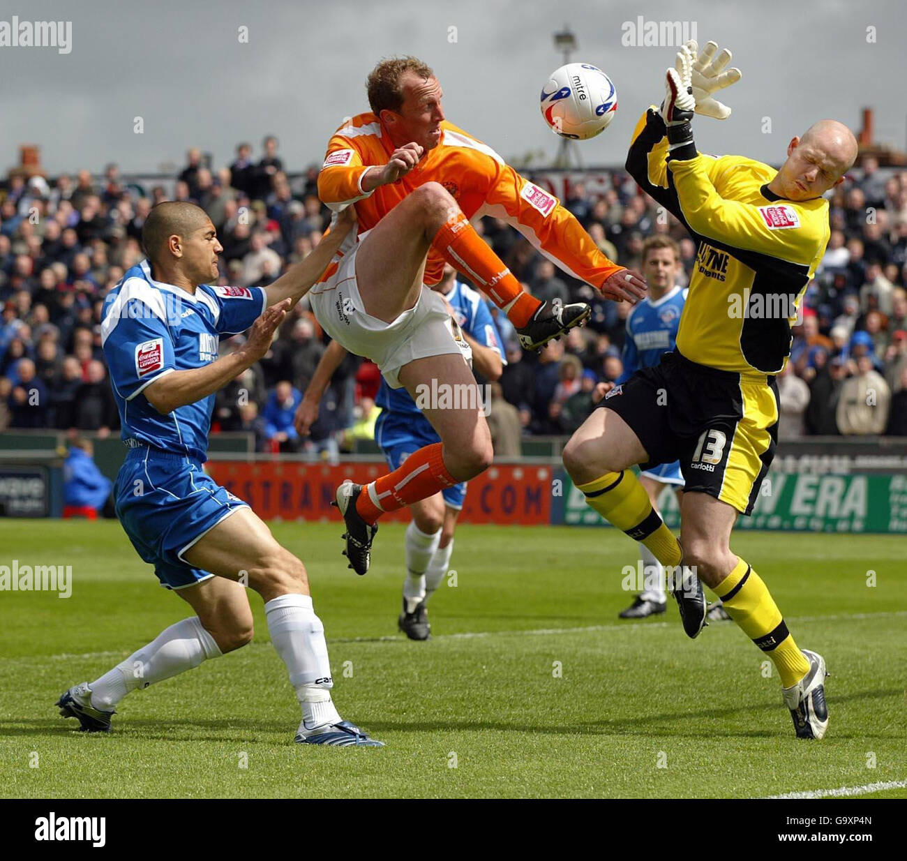 Blackpool's Andy Morrell has a close range shot deflected by the Oldham ...