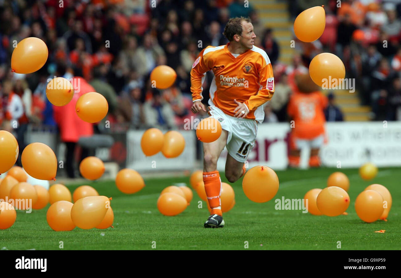 Blackpool's Andy Morrell is lost in a sea of balloons as the game ...