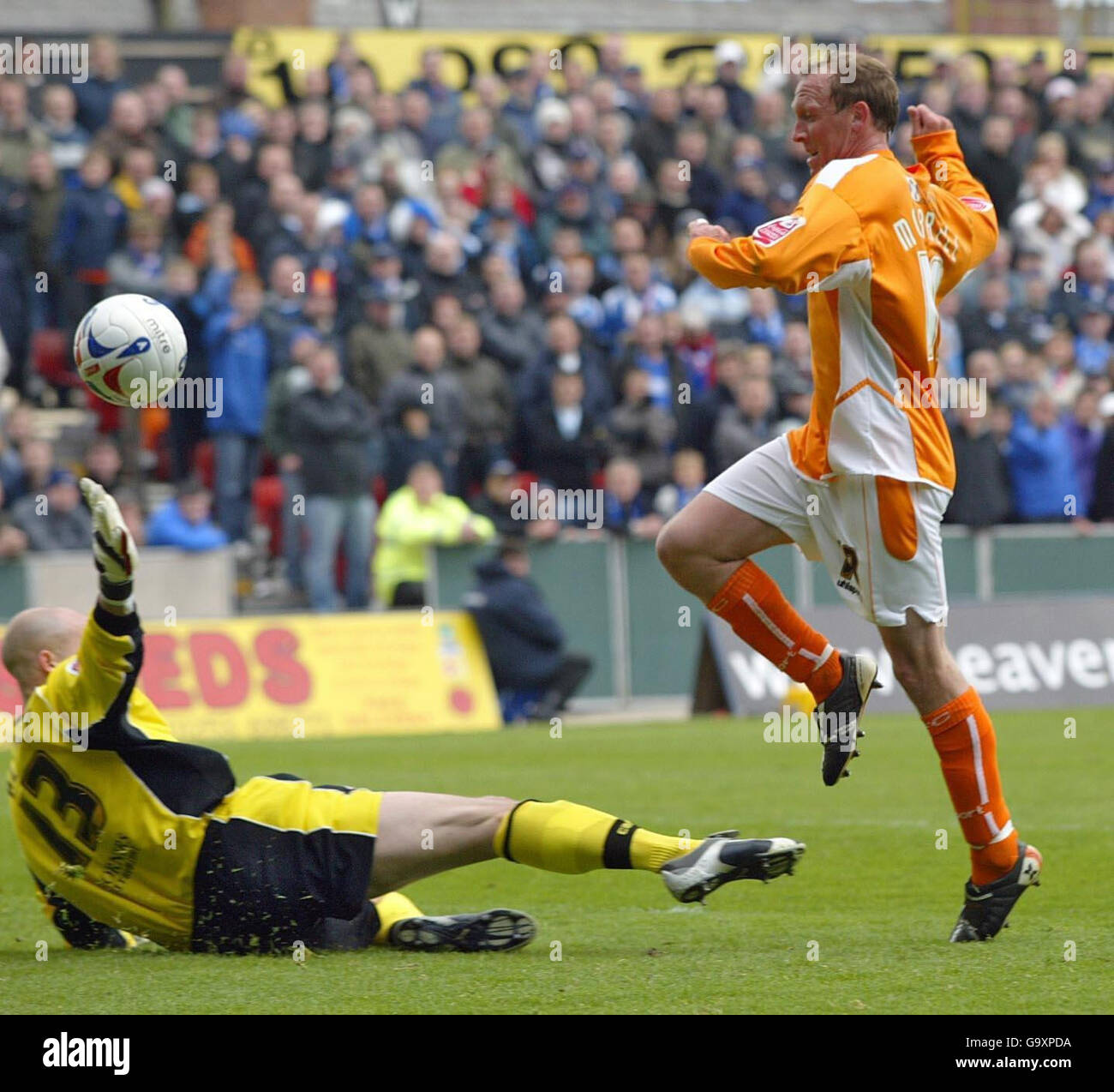 Blackpool's Andy Morrell scores past Oldham's Alan Blayney during the ...