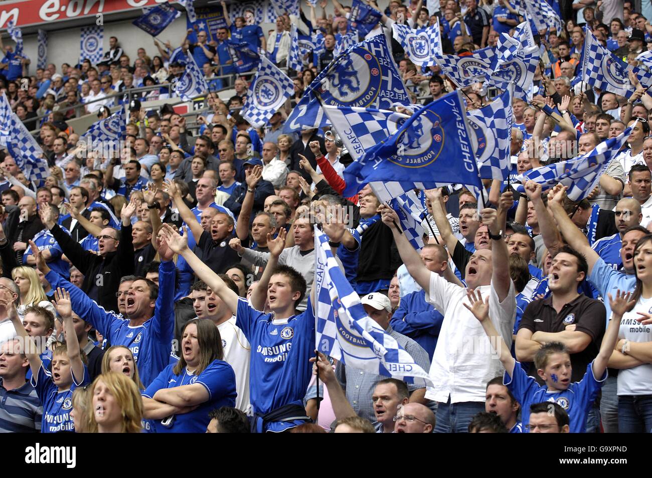 Chelsea fans cheer on their team hi-res stock photography and images ...