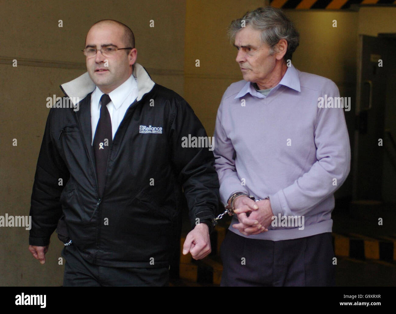 Peter Tobin (right) is led out of Edinburgh High Court Stock Photo - Alamy