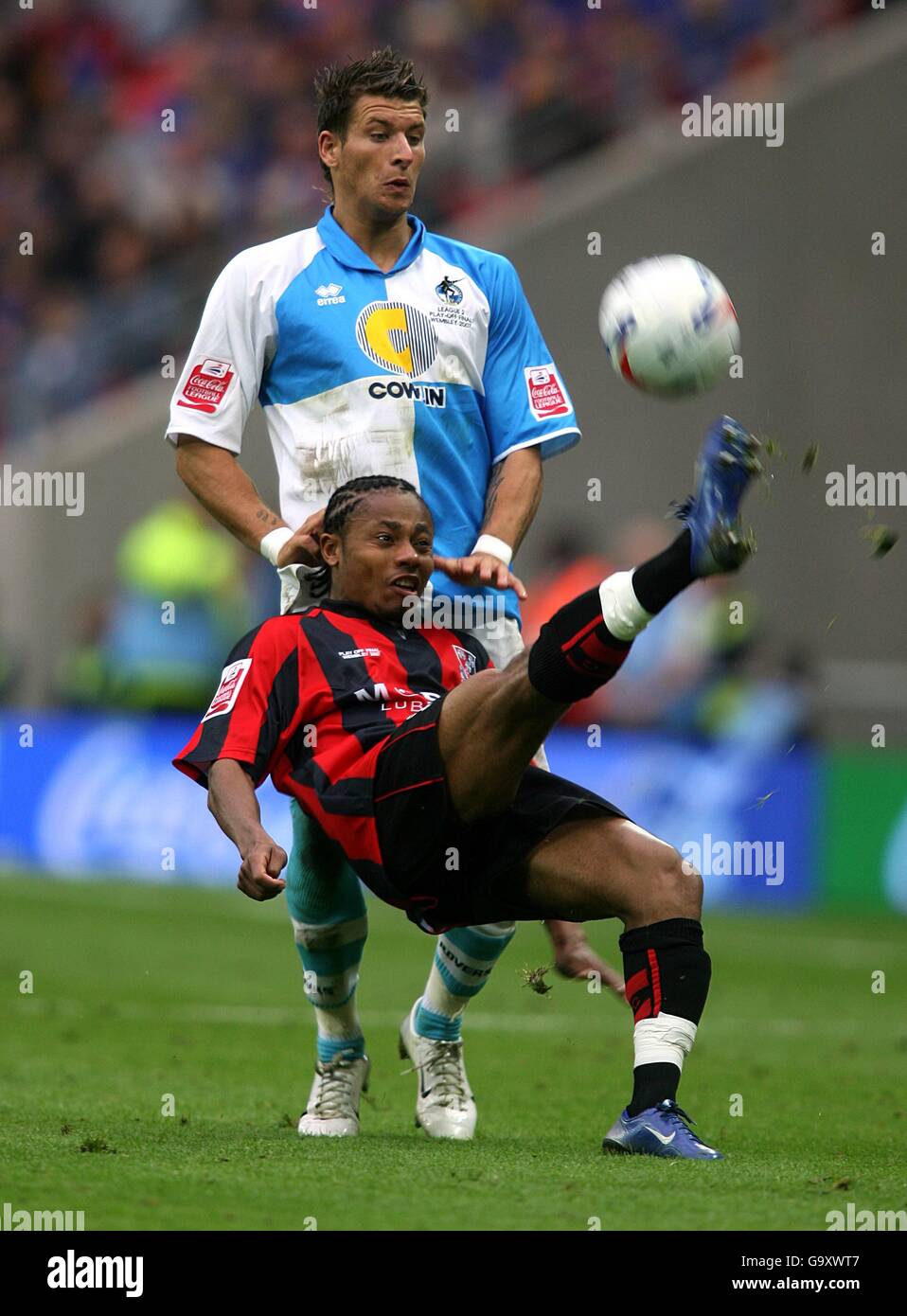 Shrewsbury Town's Derek Asamoah clears under pressure from Bristol ...