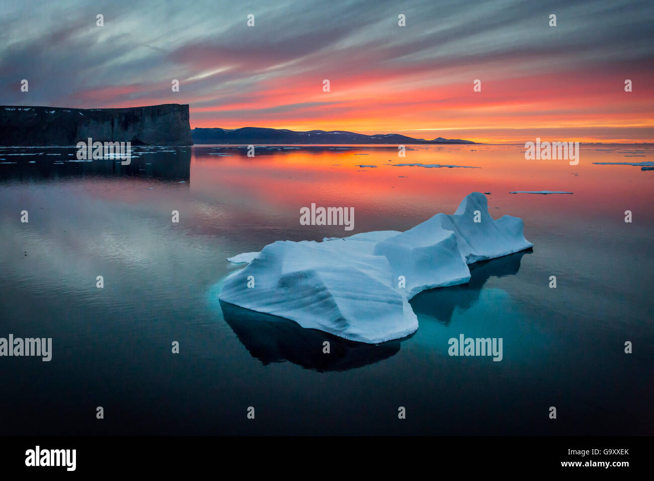 Sunset off Scott Island, with floating pieces of sea ice, Scott Inlet ...