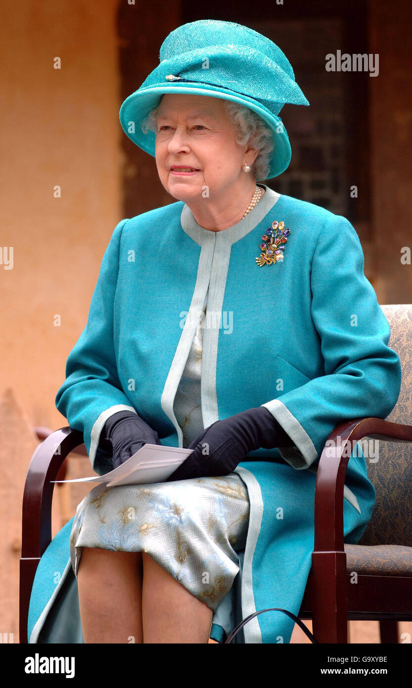 Britain's Queen Elizabeth II sits down during a visit to the ...