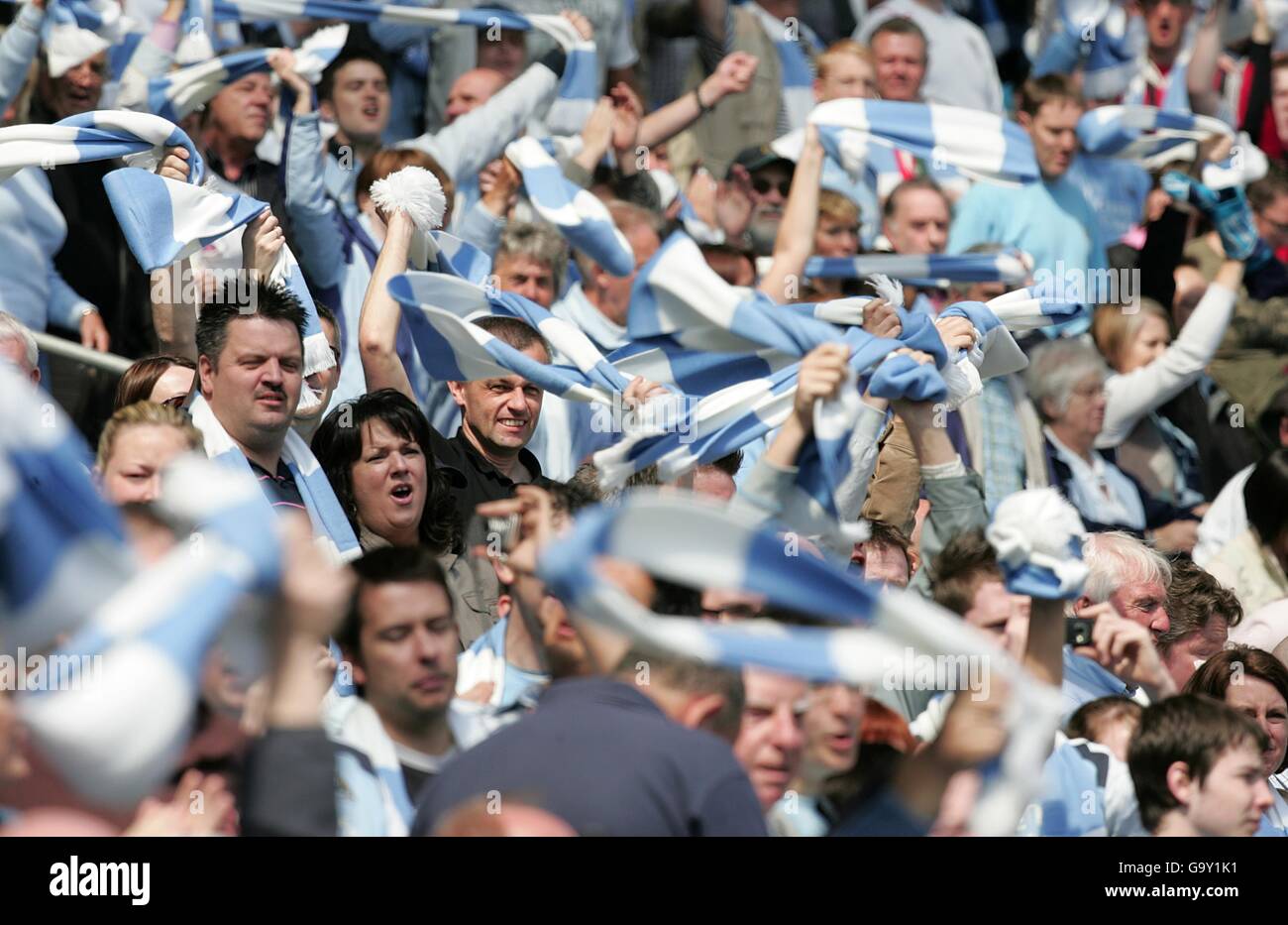Manchester city fans wave hi-res stock photography and images - Alamy