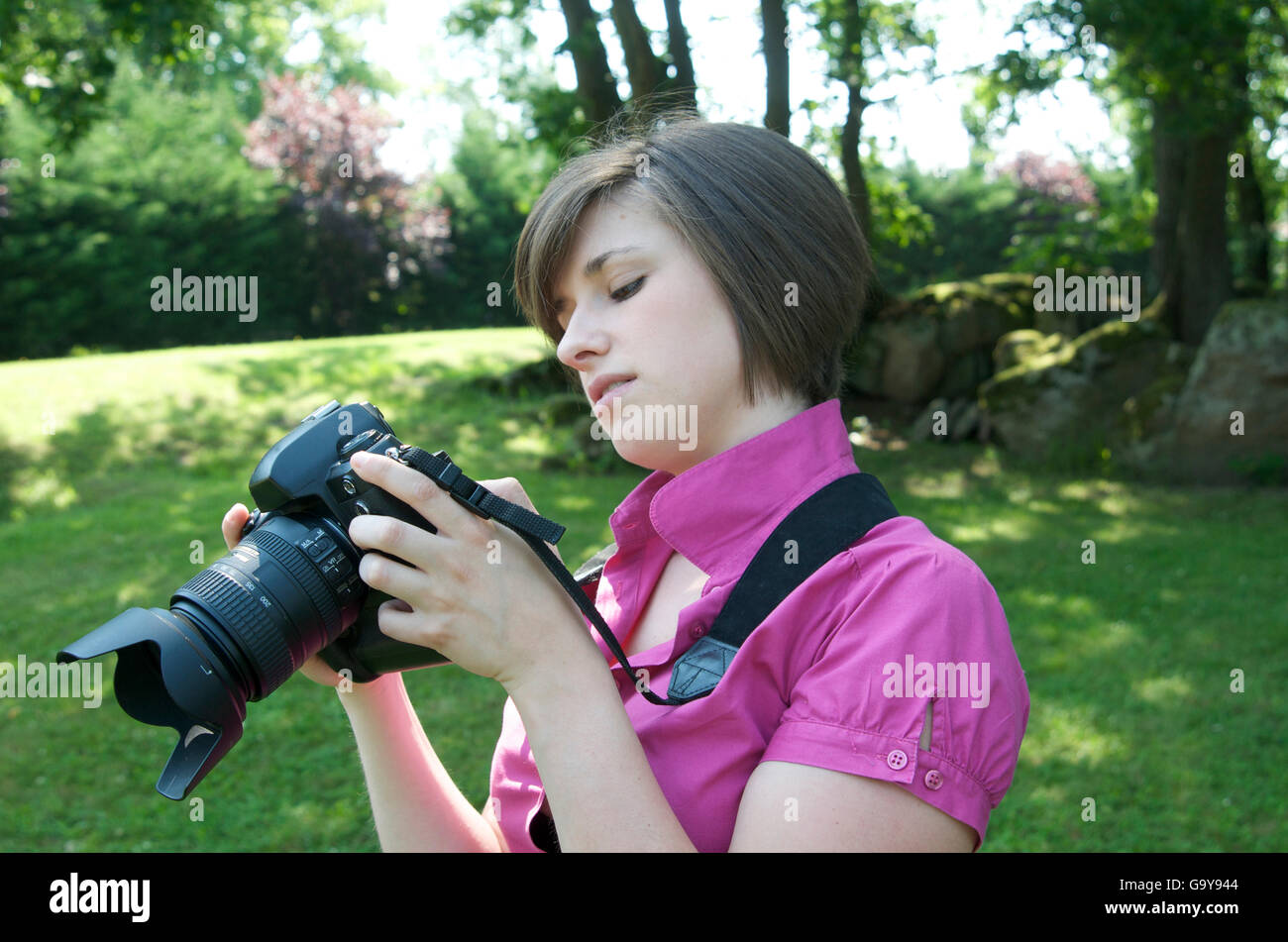 Young woman photographing Stock Photo - Alamy