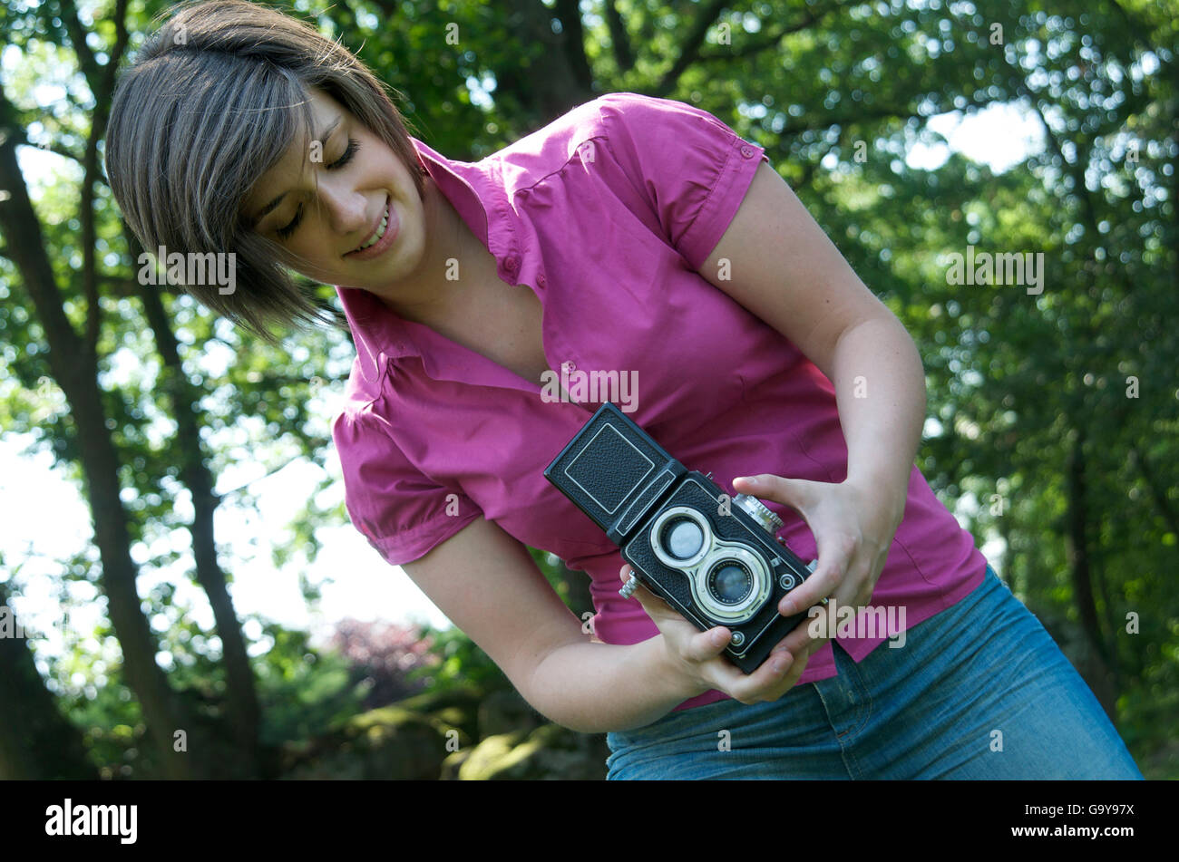 Young woman photographing Stock Photo - Alamy