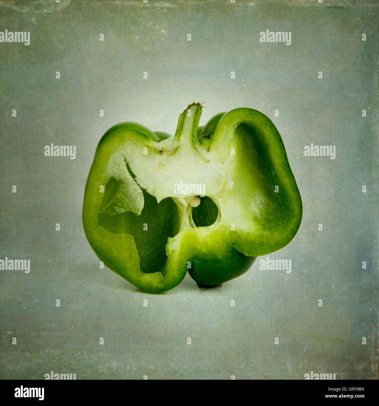 Cut green bell pepper Stock Photo - Alamy