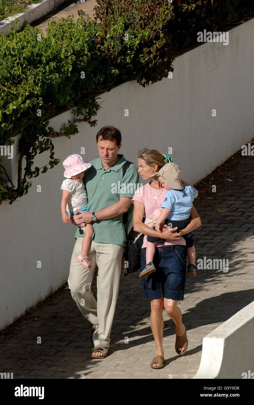 Full length walking carrying child children parents mangrk hi-res stock ...